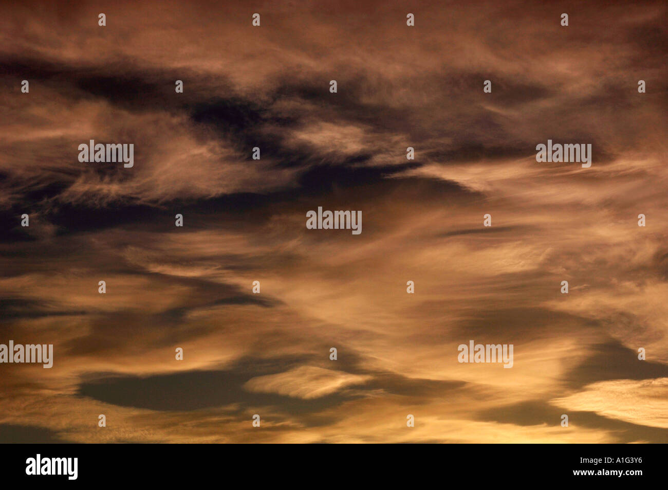 Natural Evening Sky With Warm Coloured Clouds Stock Photo - Alamy