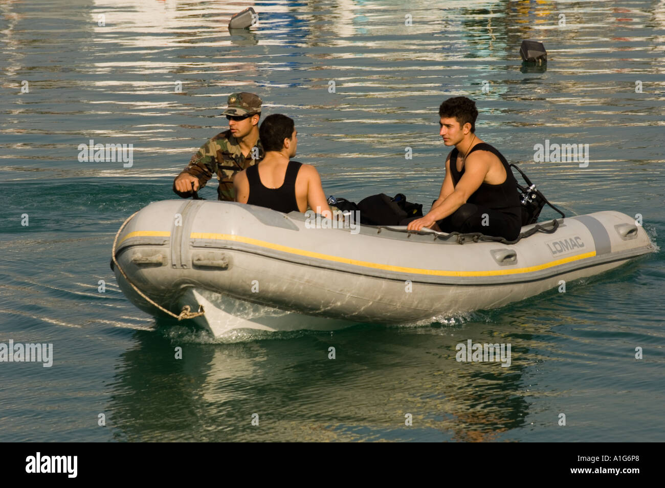 Navy seals in small boat Stock Photo - Alamy