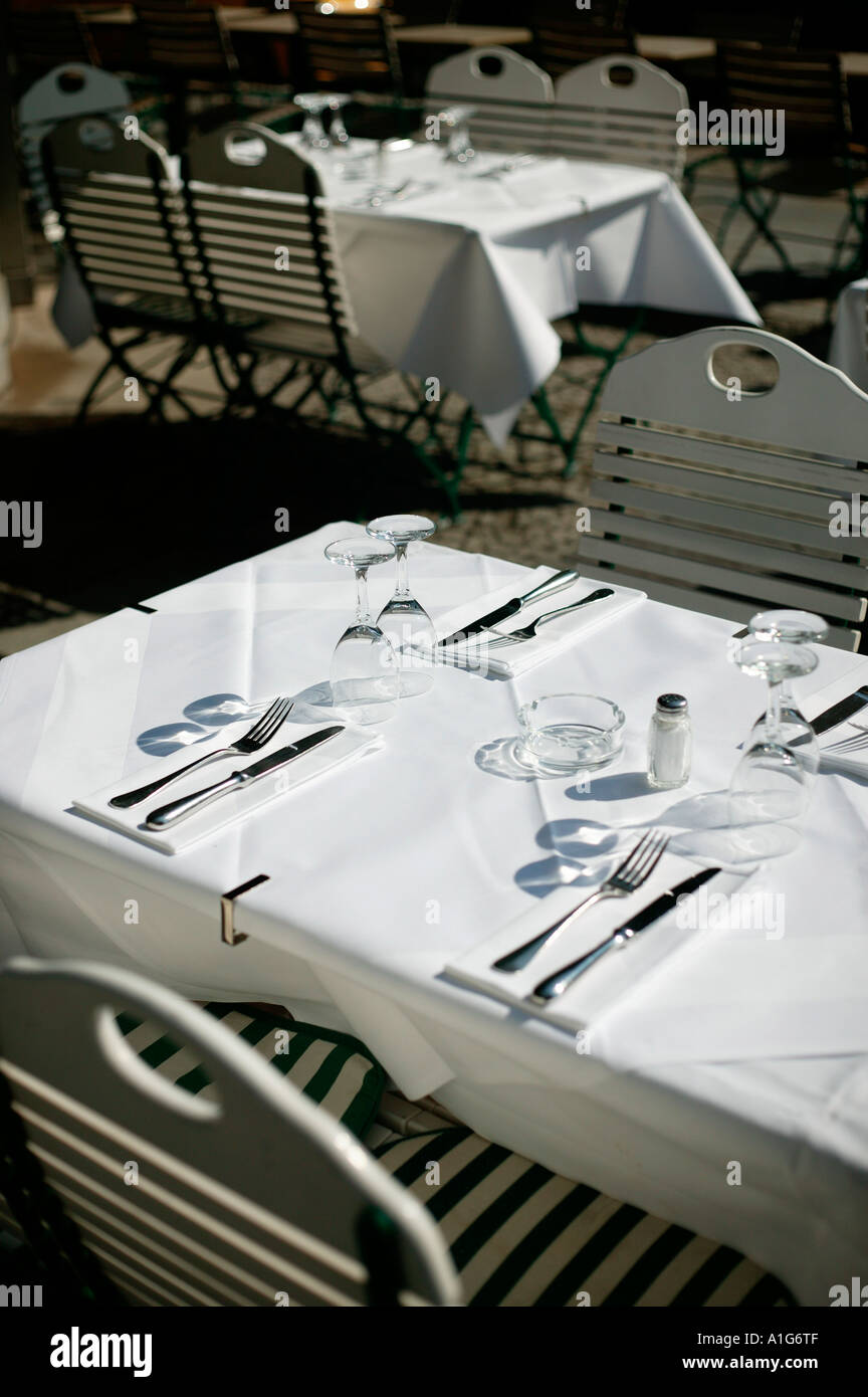 White covered table in sunny light Stock Photo - Alamy