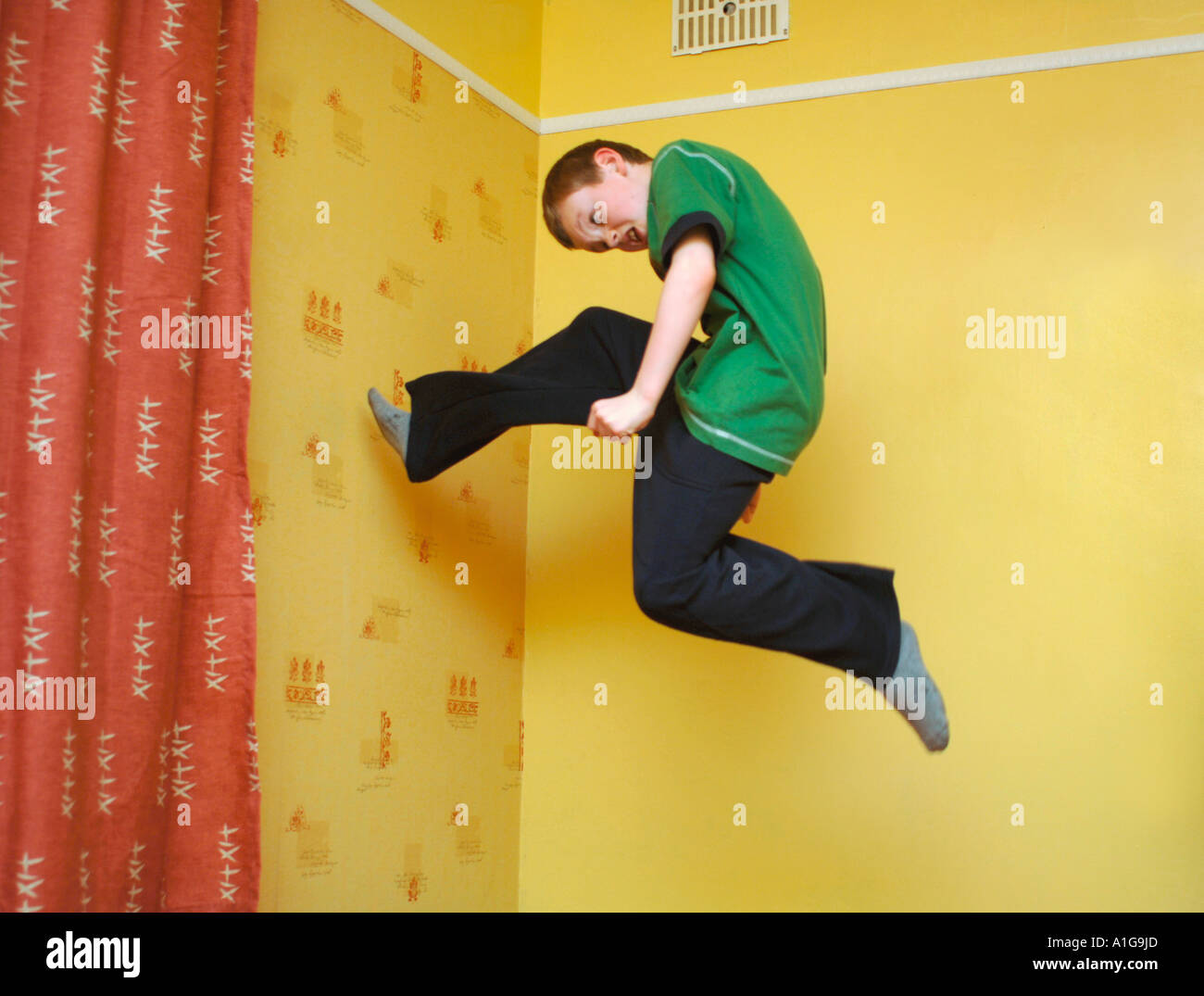 Boy Running Up A Wall Stock Photo - Alamy
