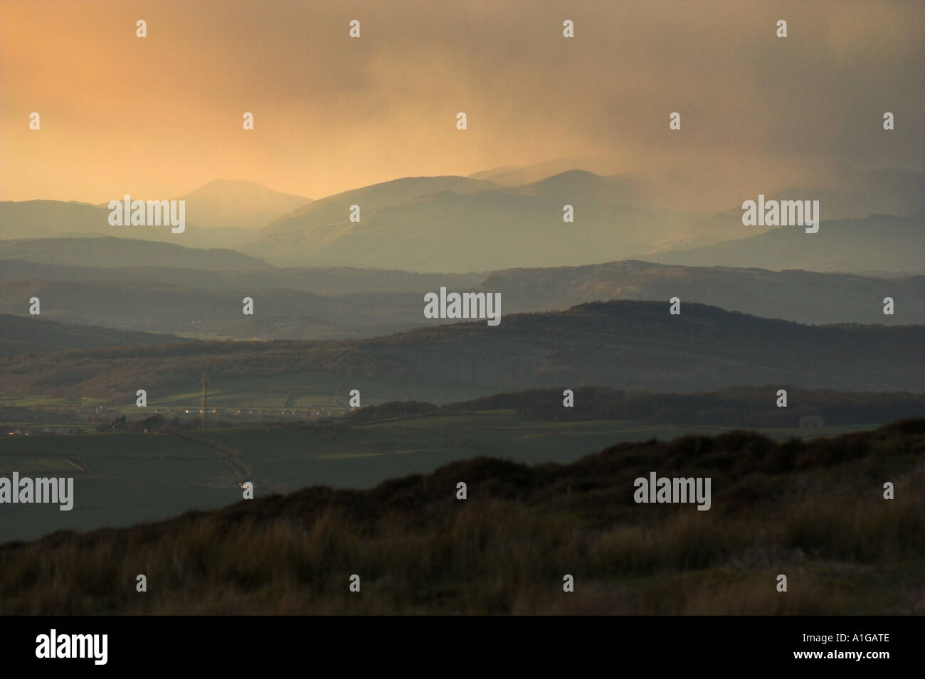 misty layered landscape at sunset during rain shower weather Stock ...