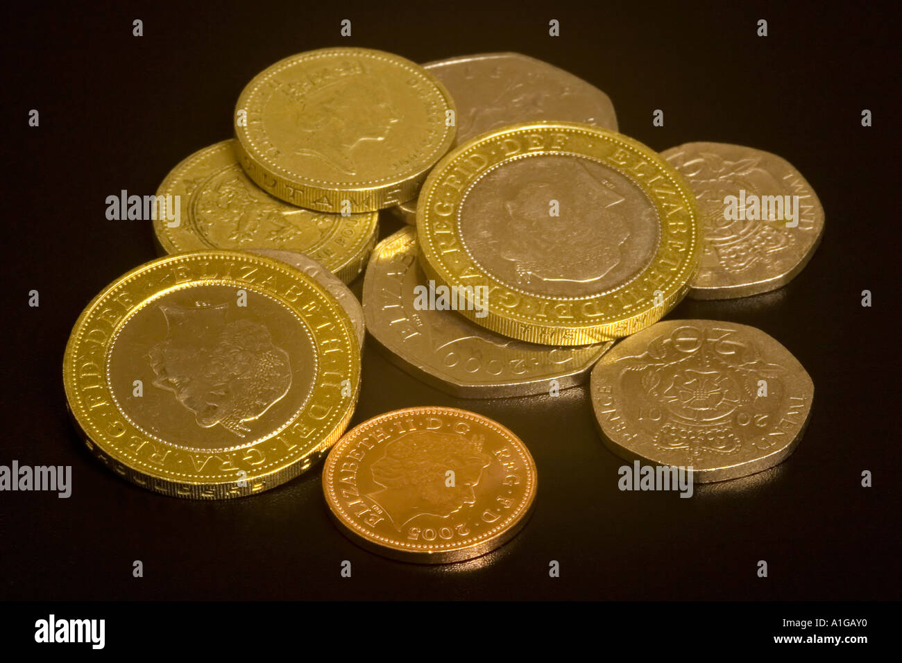 selection of British coins with a black background Stock Photo - Alamy
