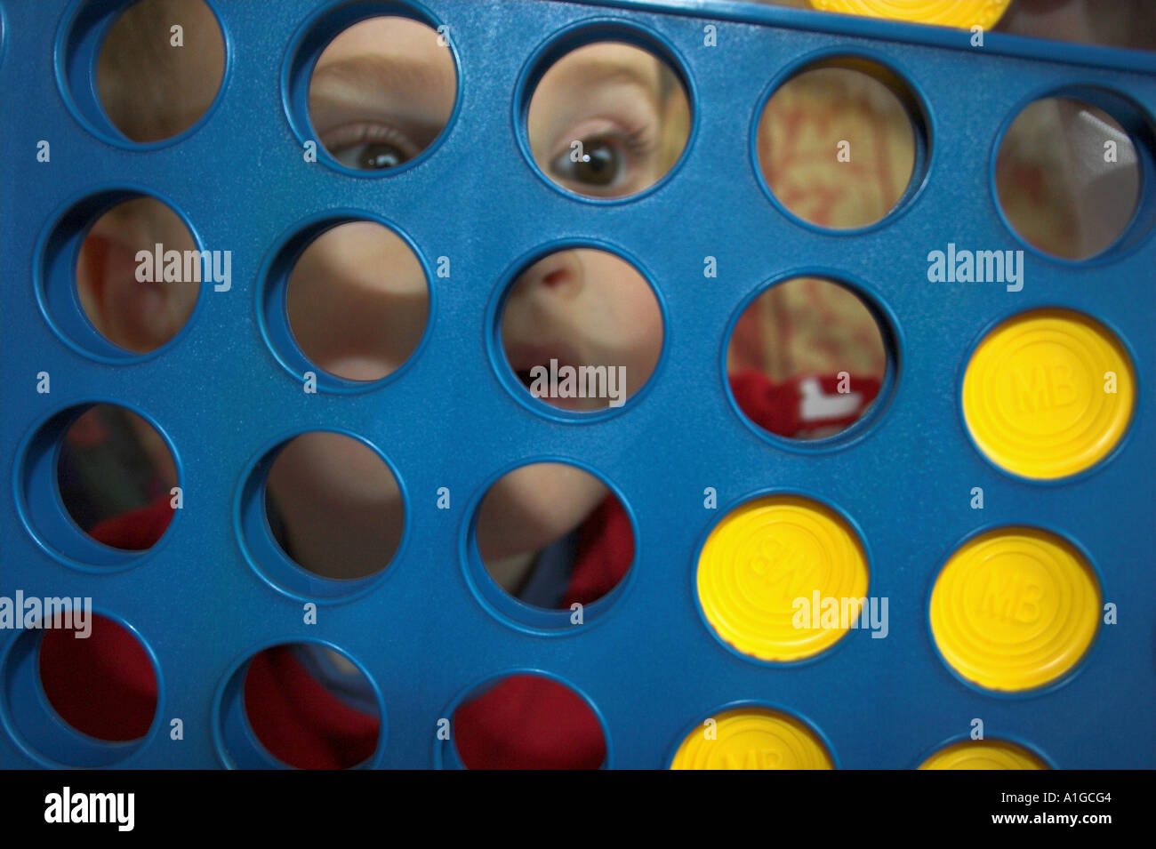child playing Connect 4 game Stock Photo - Alamy