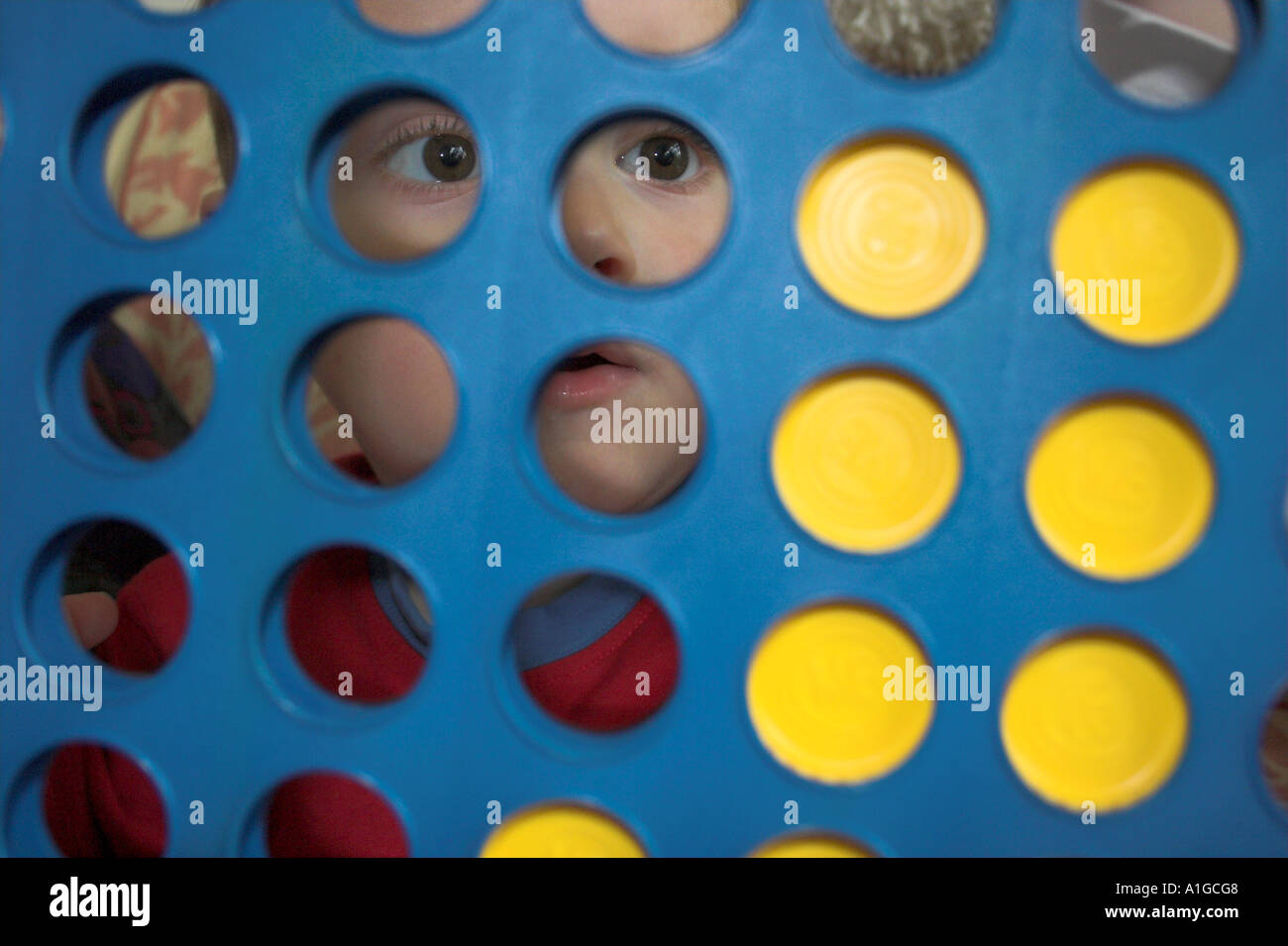 child playing Connect 4 game Stock Photo - Alamy