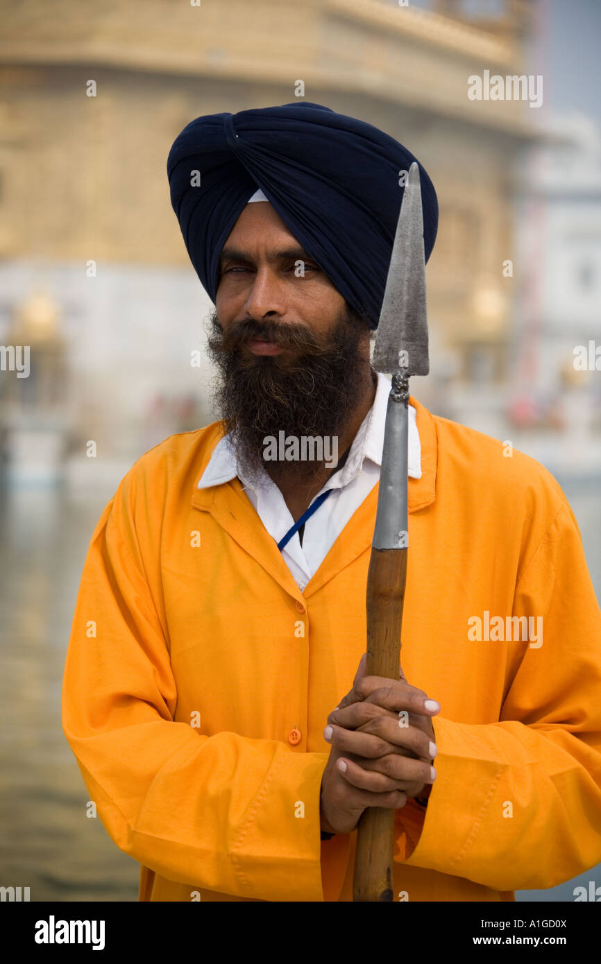 Sikh guard in The Golden Temple Complex in the Sikh city of Amritsar in ...