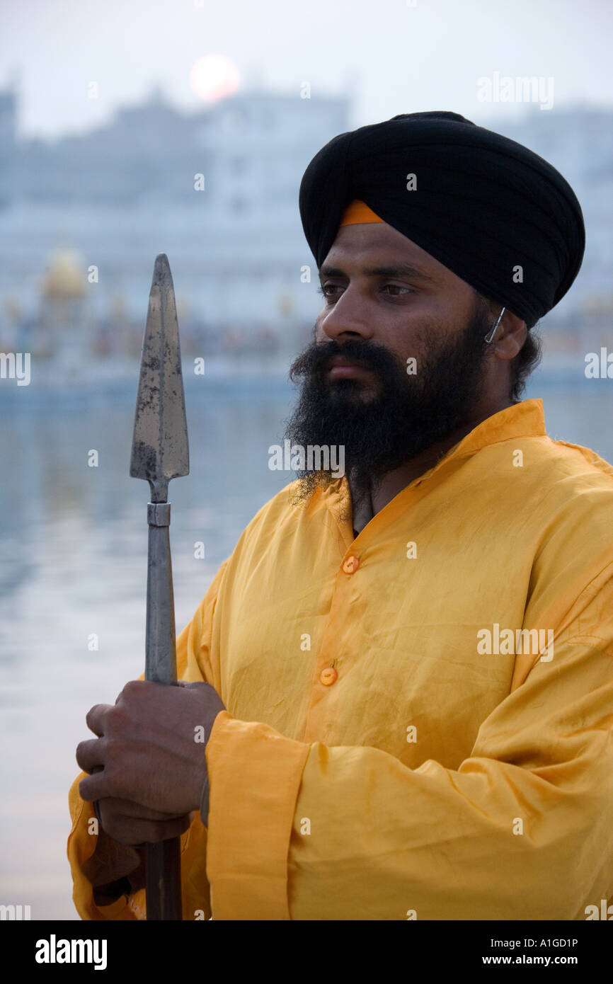 Sikh guard in The Golden Temple Complex in the Sikh city of Amritsar in ...