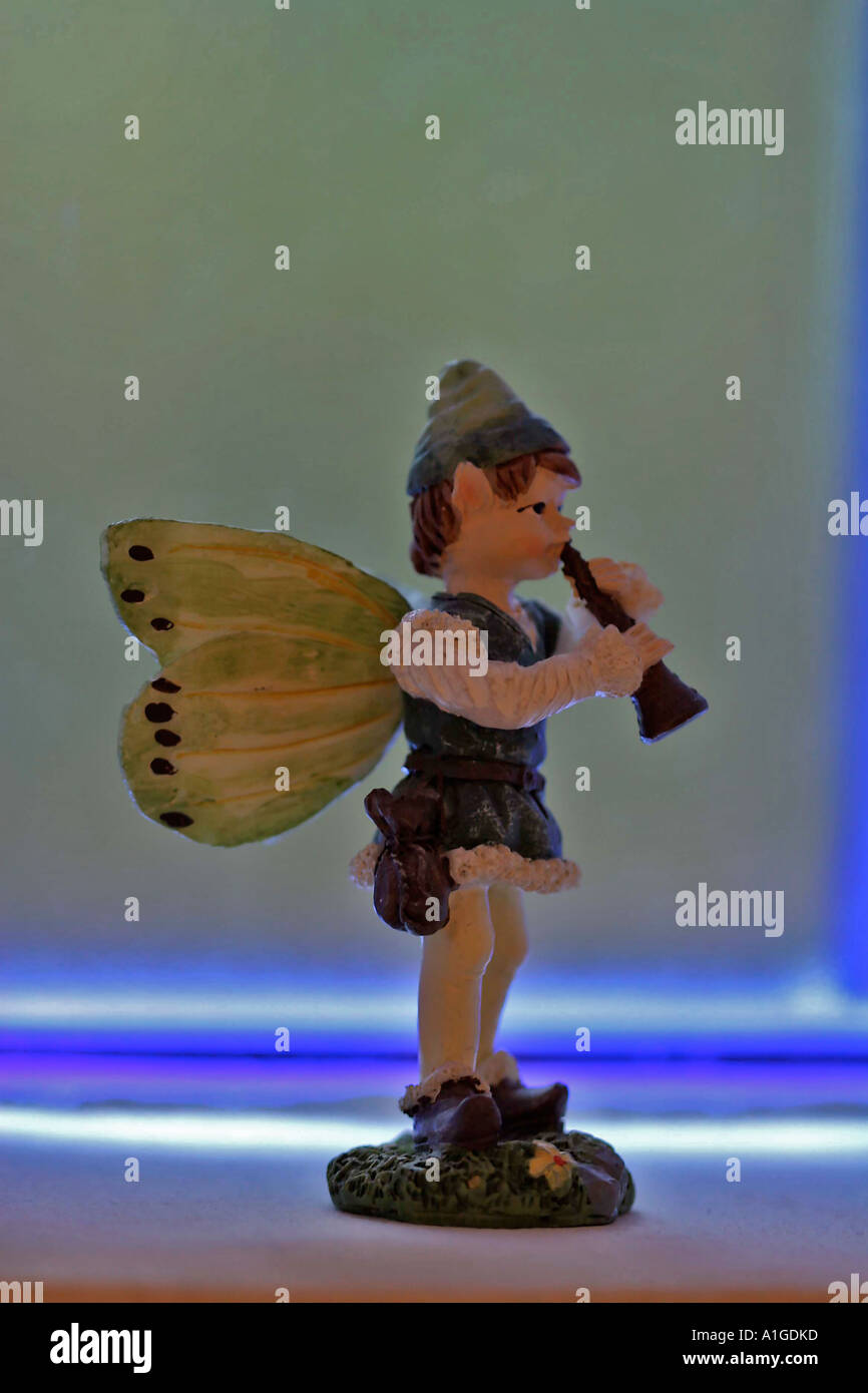 winged elf playing the flute Stock Photo - Alamy