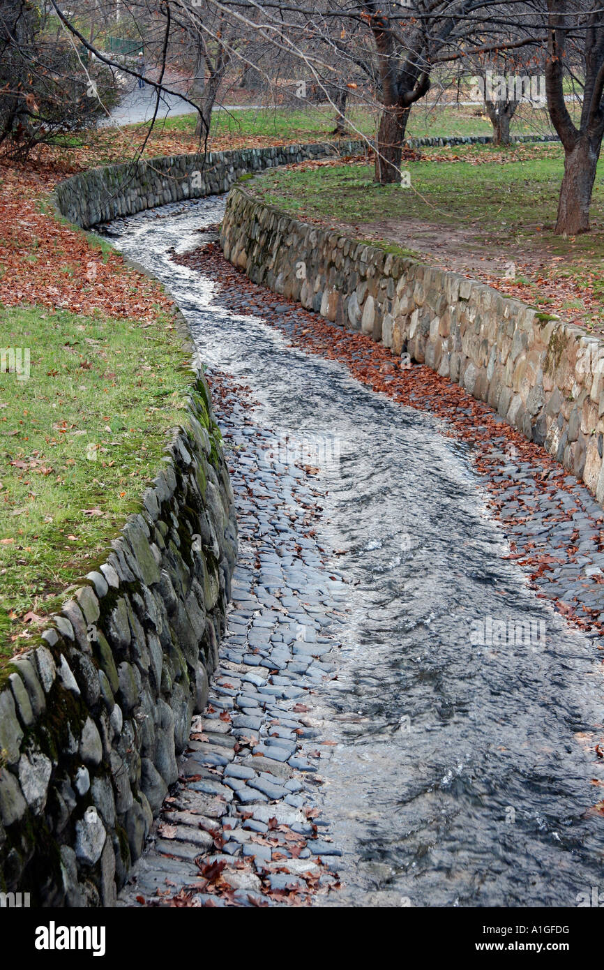 Winding stream with stone walls Stock Photo - Alamy