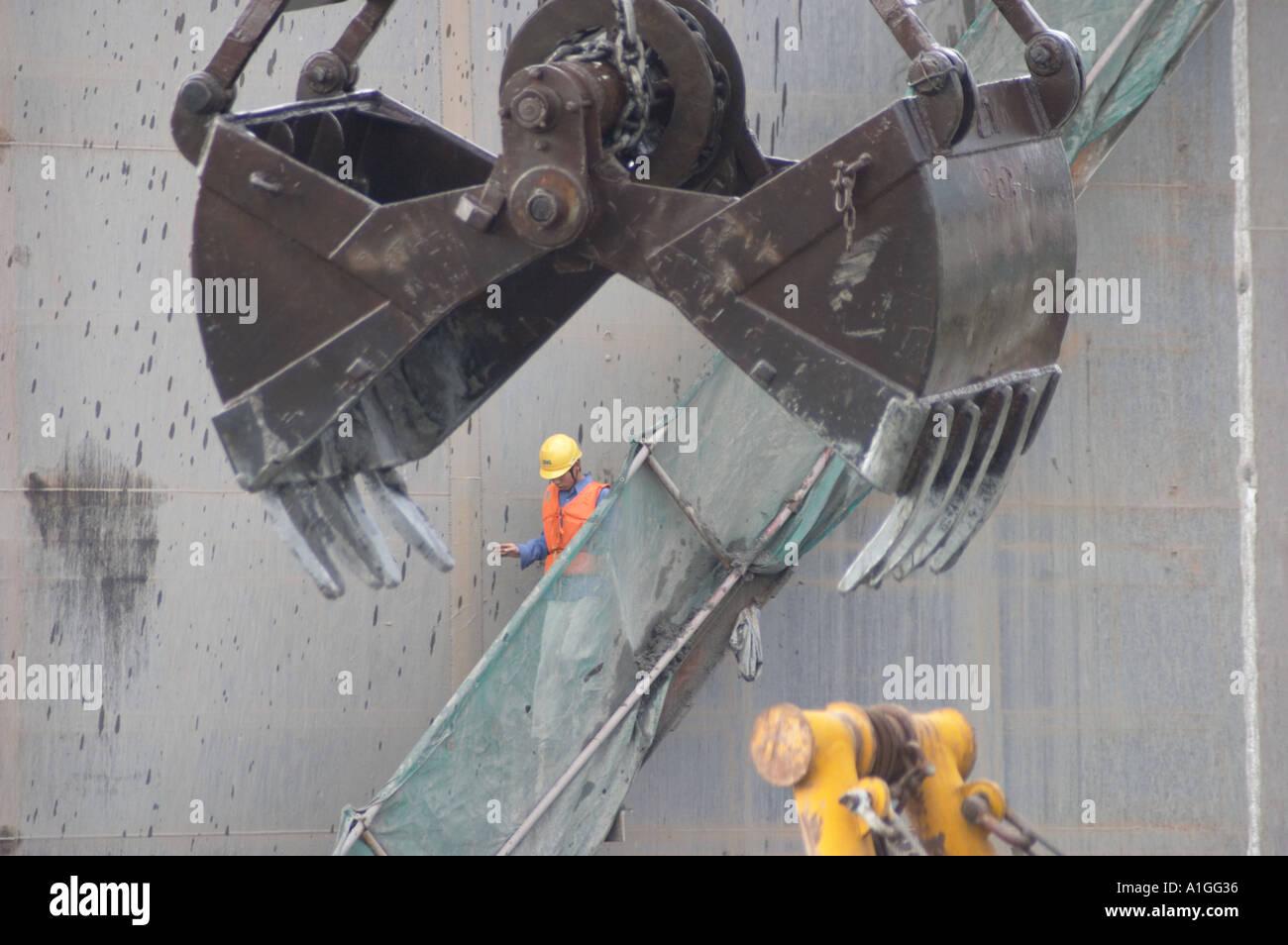 construction worker and jcb digger bucket grabber in shanghai china ...