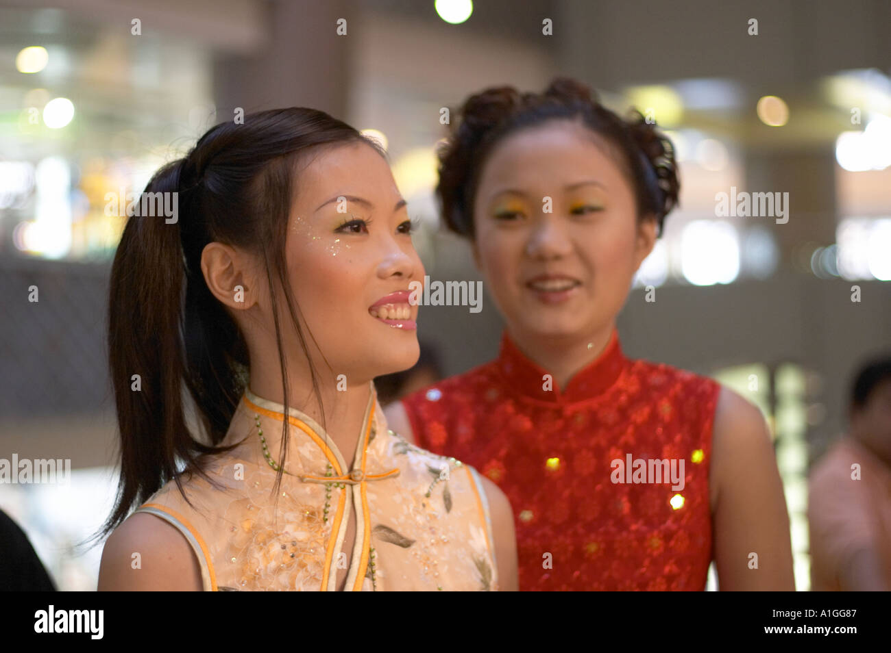 girls displaying clothes in superbrand mall shopping centre in shanghai ...