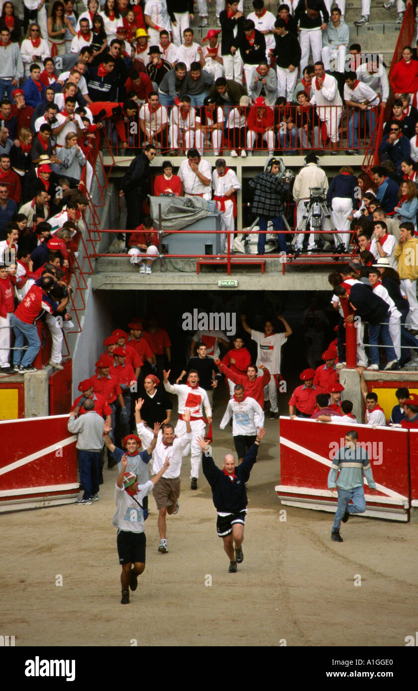 First runners arrive in Plaza de Toros during running of the bulls ...