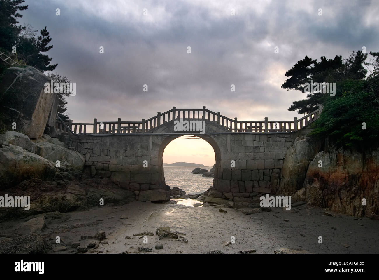 small buddhist bridge linking a temple to the main island of the ...