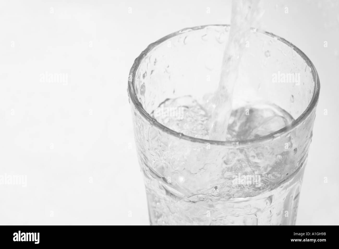 water pouring into glass Stock Photo - Alamy
