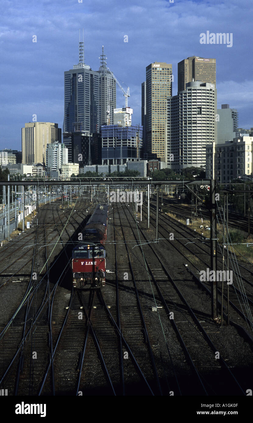 V-Line diesel hauled passenger train with city centre behind, Melbourne ...