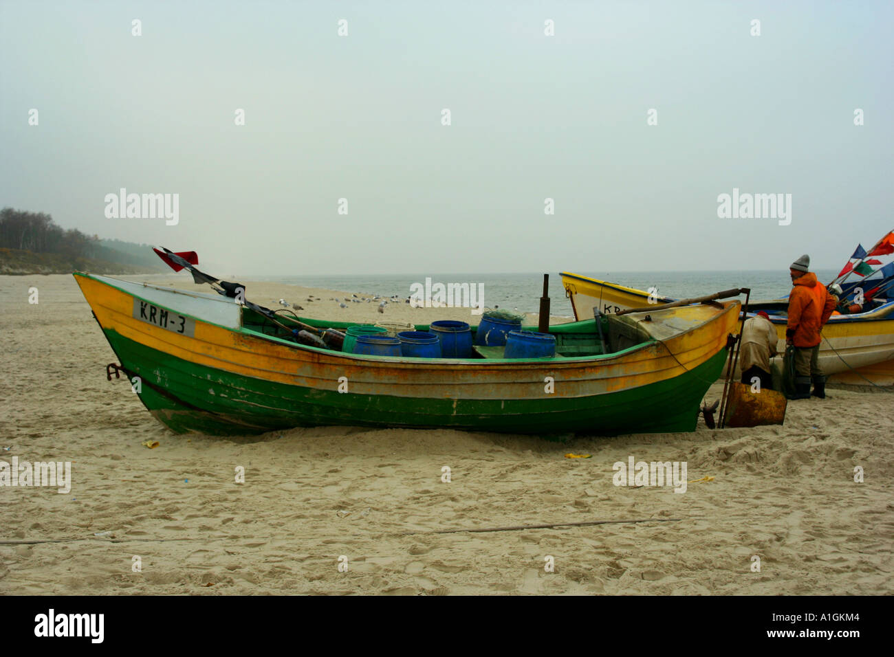 Fishing boat on a beach Stock Photo - Alamy