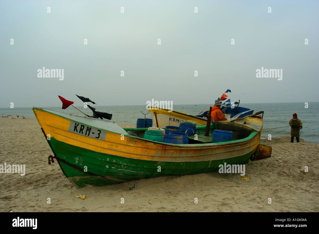 Fishing boat on a beach Stock Photo - Alamy