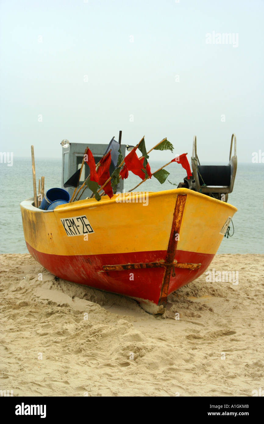 Fishing boat on a beach Stock Photo - Alamy