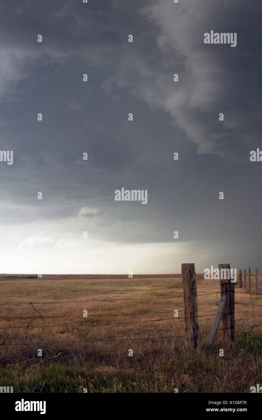 Dark thunderheads over Kansas field with fence USA Stock Photo - Alamy