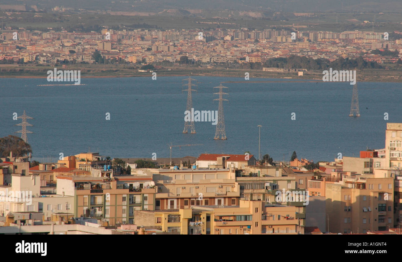 Electricity pylons stride across the lagoon in Cagliari Stock Photo - Alamy