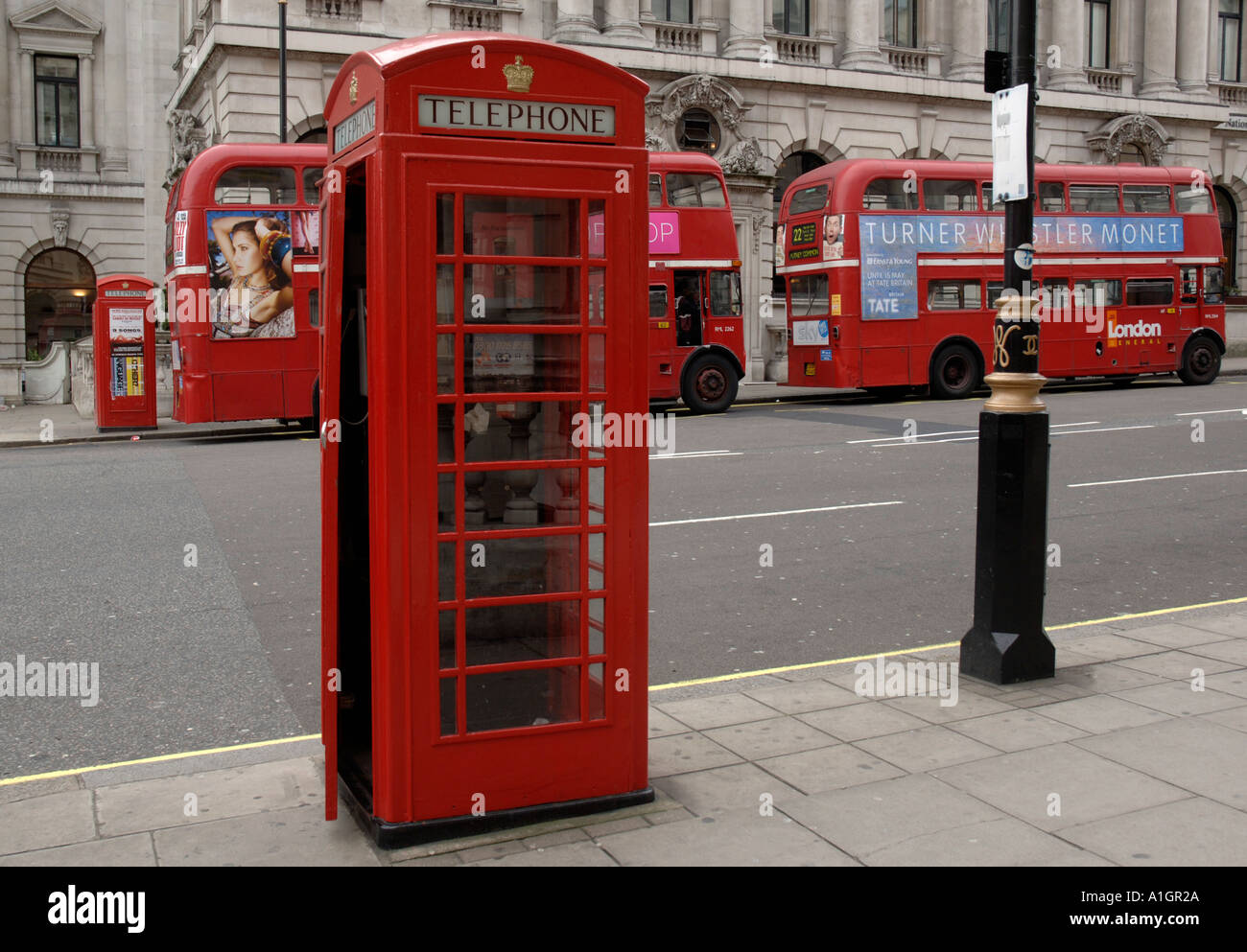 Red telephone boxes and routemaster buses in London UK Stock Photo - Alamy