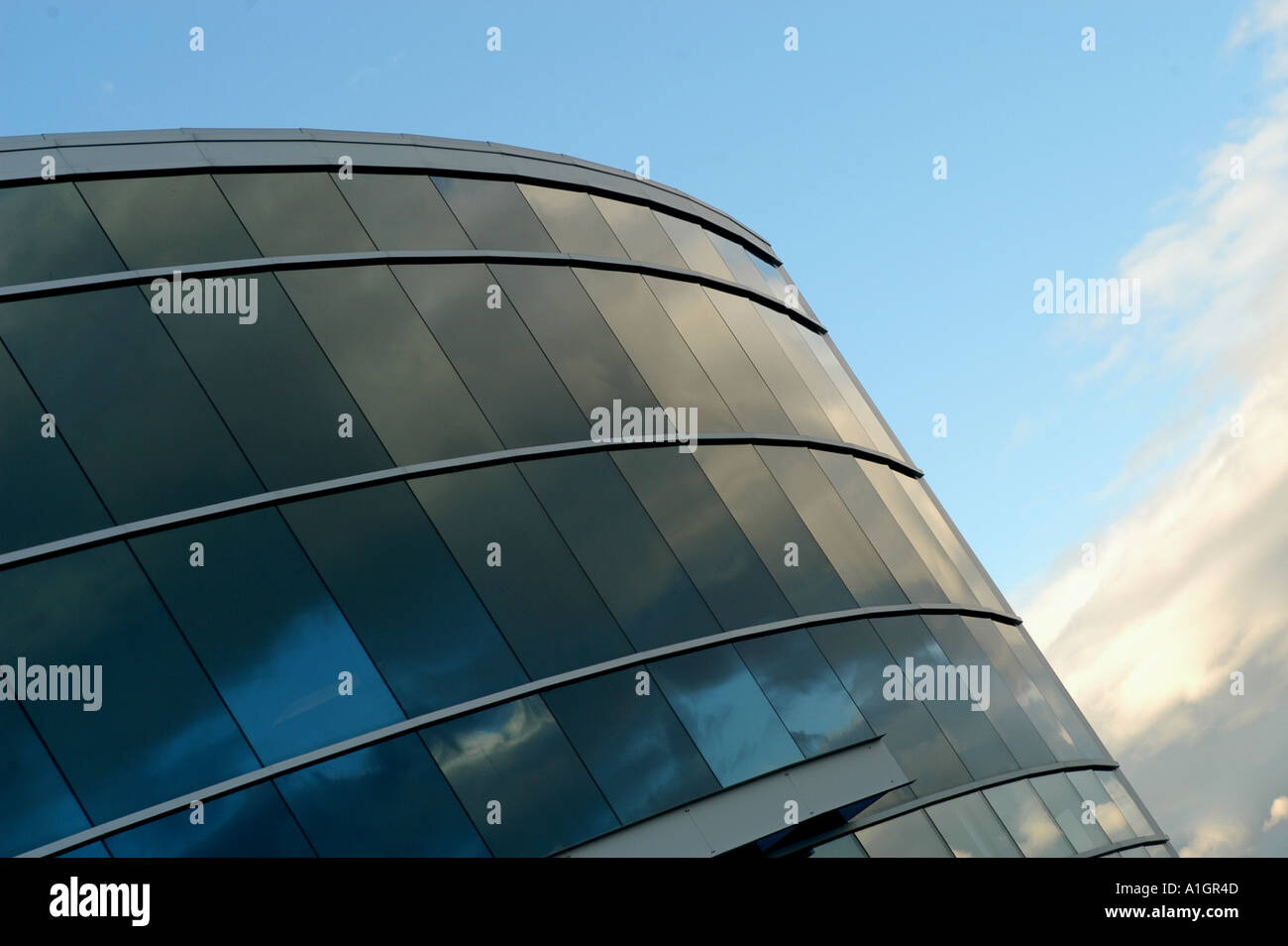 Round building reflecting the sky Stock Photo - Alamy