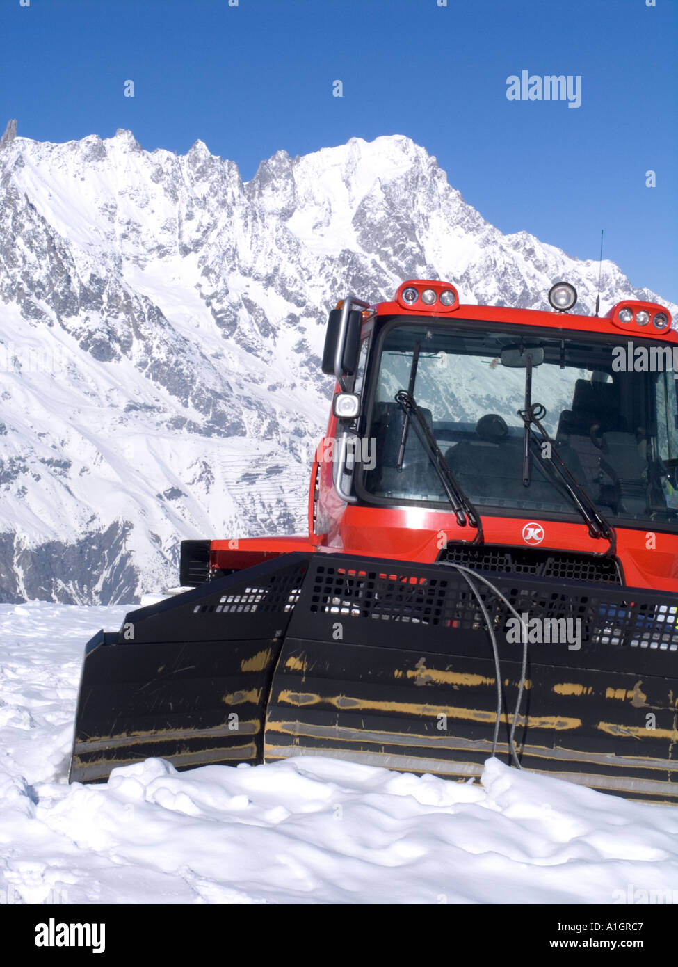 PISTE BASHER ON MOUNTAIN Stock Photo - Alamy