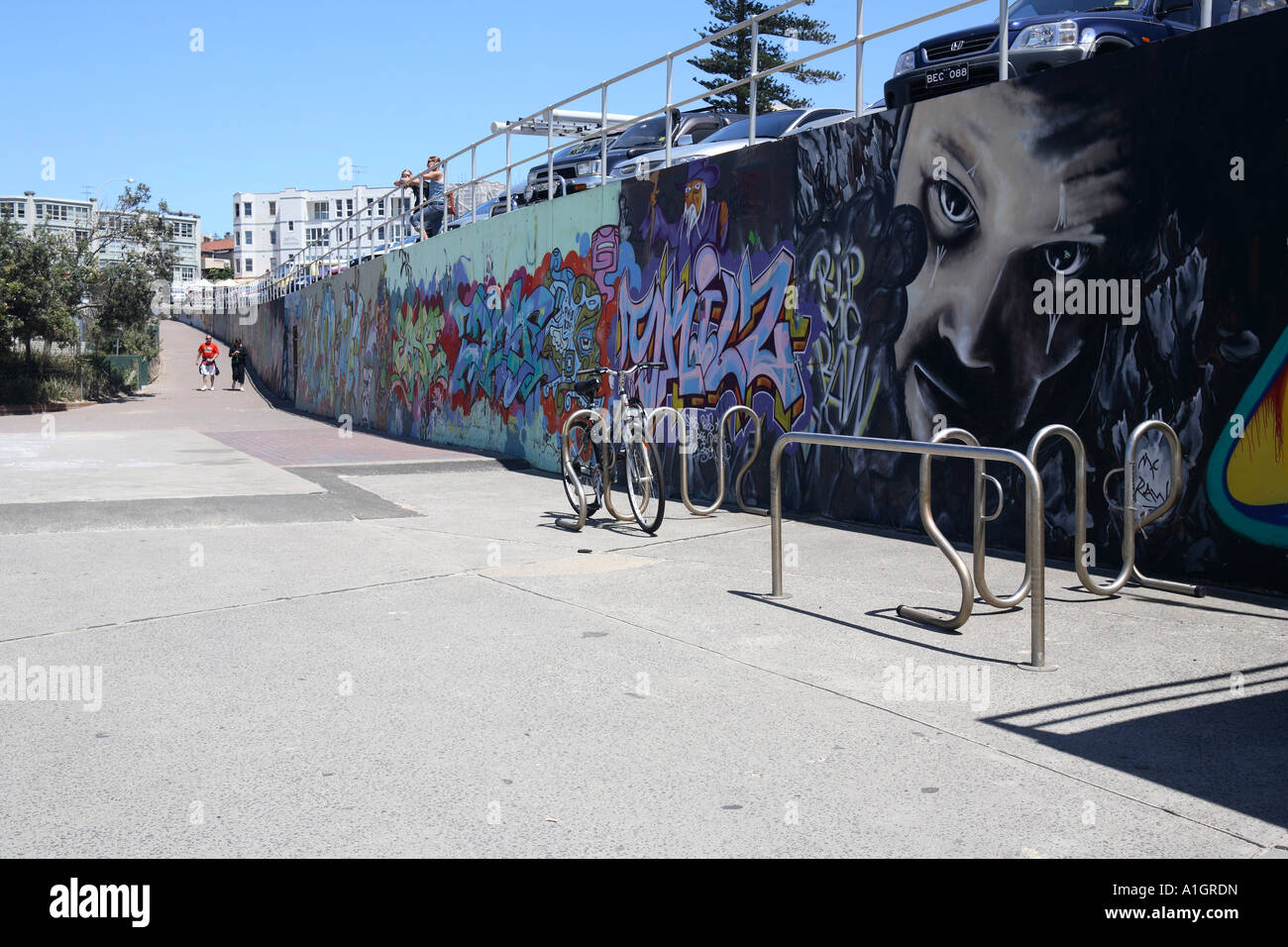 Bondi Beach access walkway, bicycle stand, wall of graffiti, Sydney ...