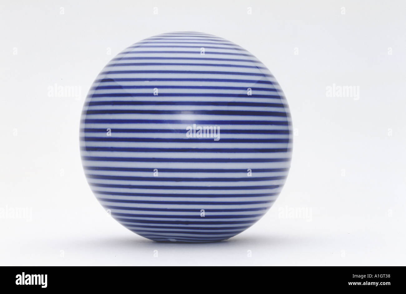 Round circular ball with blue white stripes Stock Photo - Alamy