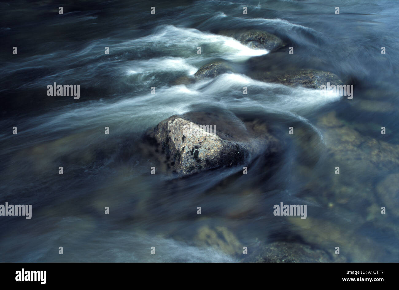 River water flowing over rocks Stock Photo - Alamy