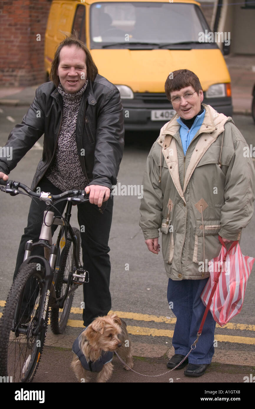 mother and son with dog among tenement blocks on Barrow Island, Barrow ...