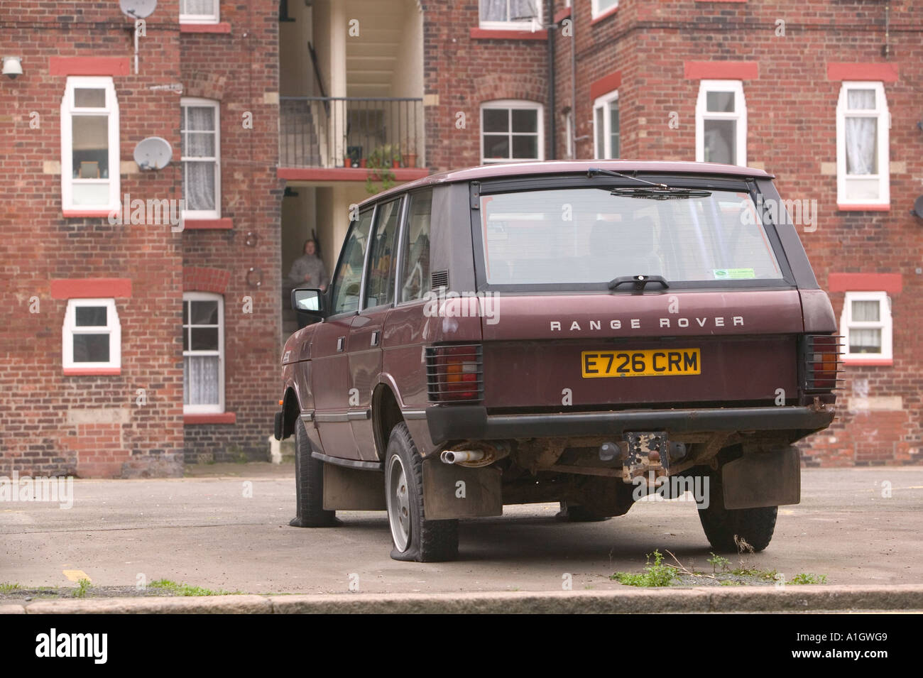 a Range Rover with 3 flat tyres on a rough estate on Barrow Island ...