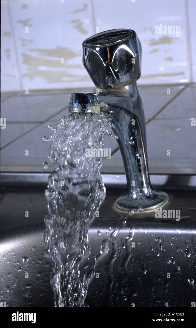 clean water flowing from tap showing water droplets in kitchen Stock ...