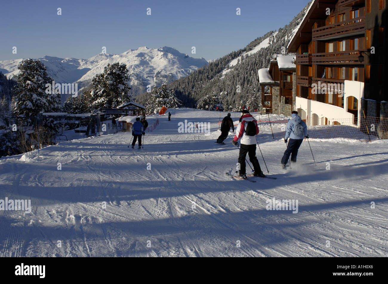 Skiing through french alpine village hi-res stock photography and ...