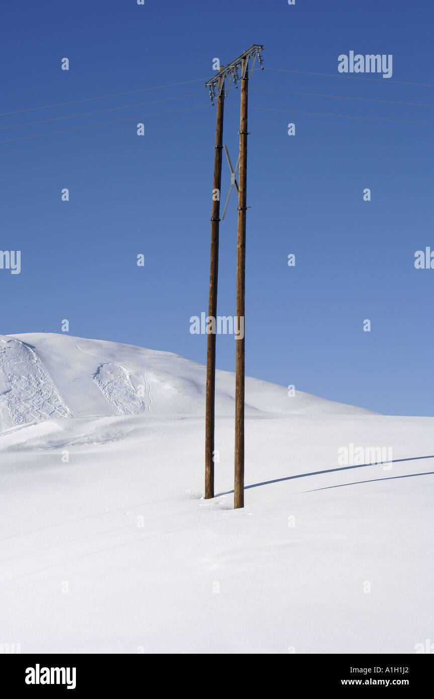 electricity pylon set in deep snow Stock Photo - Alamy