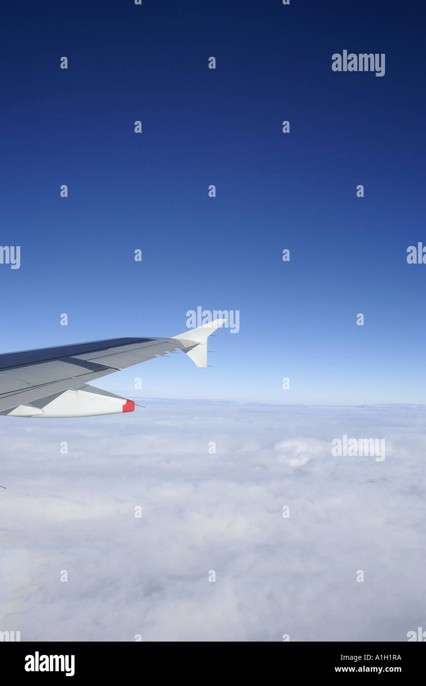 Window view of aircraft wingtip in flight over europe in winter Stock ...