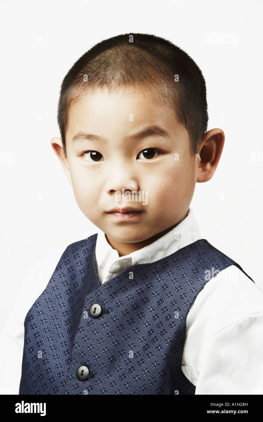 Portrait of a boy looking serious Stock Photo - Alamy
