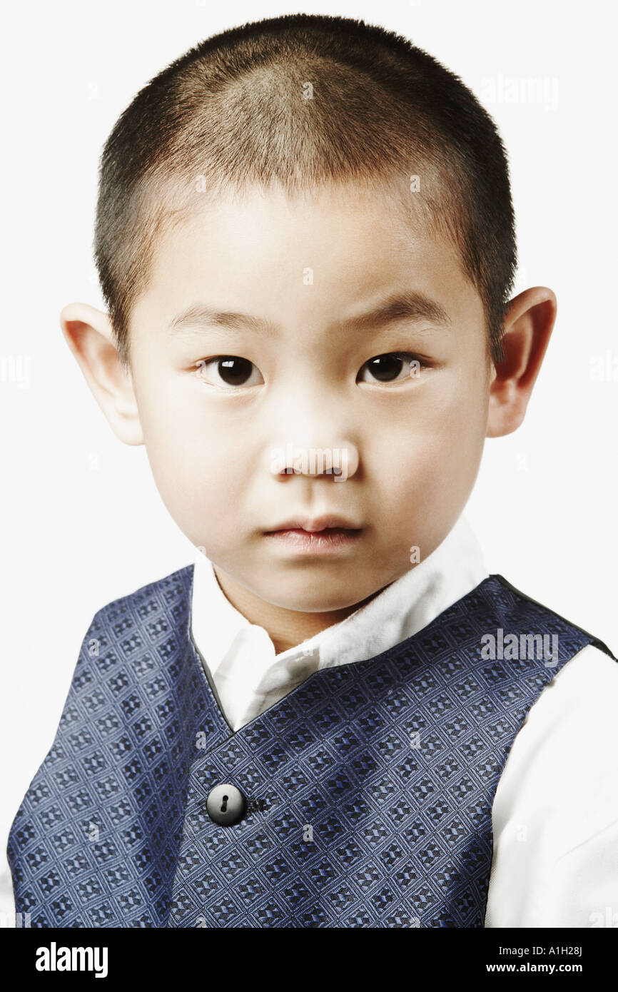 Portrait of a boy looking serious Stock Photo - Alamy