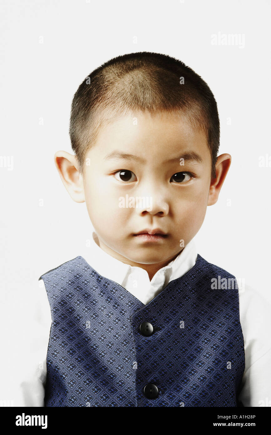 Portrait of a boy looking serious Stock Photo - Alamy