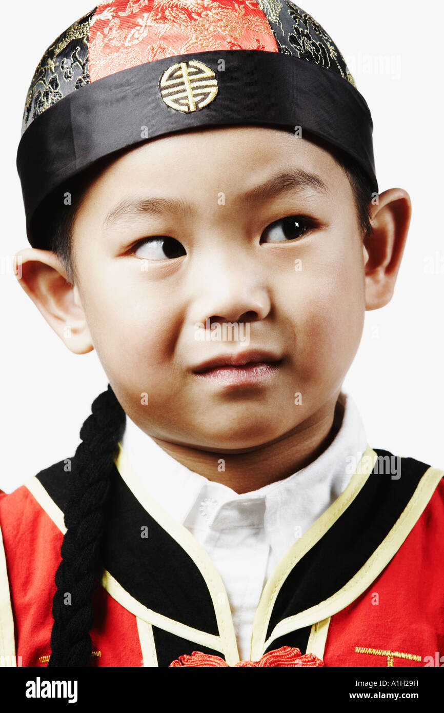Close-up of a boy looking sideways thinking Stock Photo - Alamy