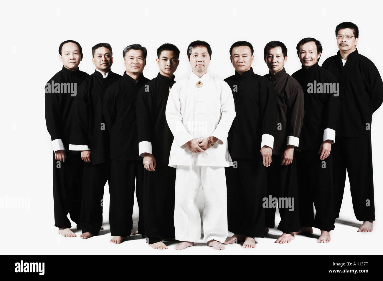 Portrait of a group of people standing in a row Stock Photo - Alamy