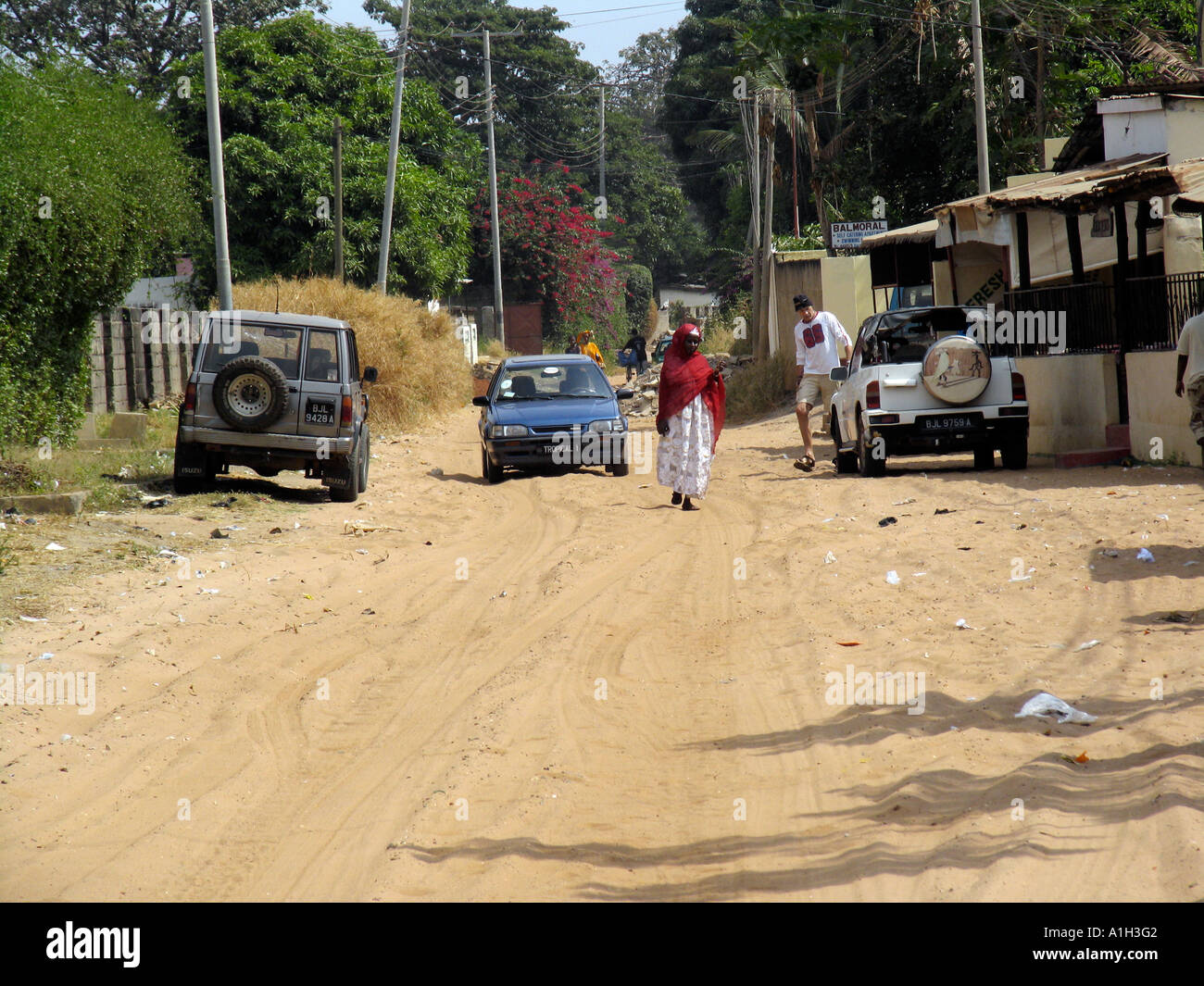 Sandy side street Kololi village The Gambia Stock Photo - Alamy