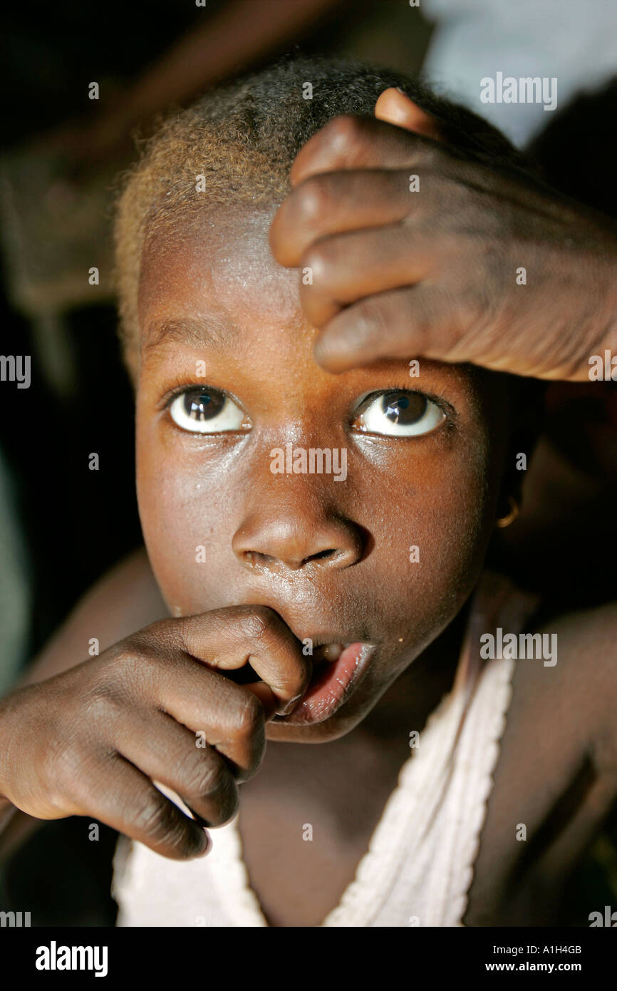 Young girl scratches head Berending village south of The Gambia Stock ...