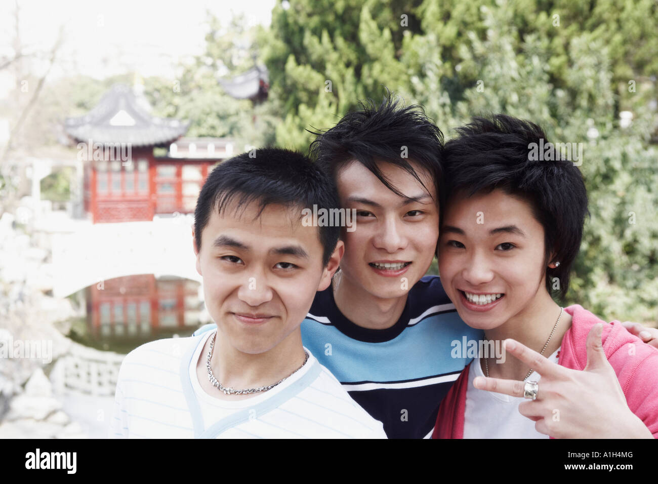 Portrait of a teenage boy and two young men Stock Photo - Alamy