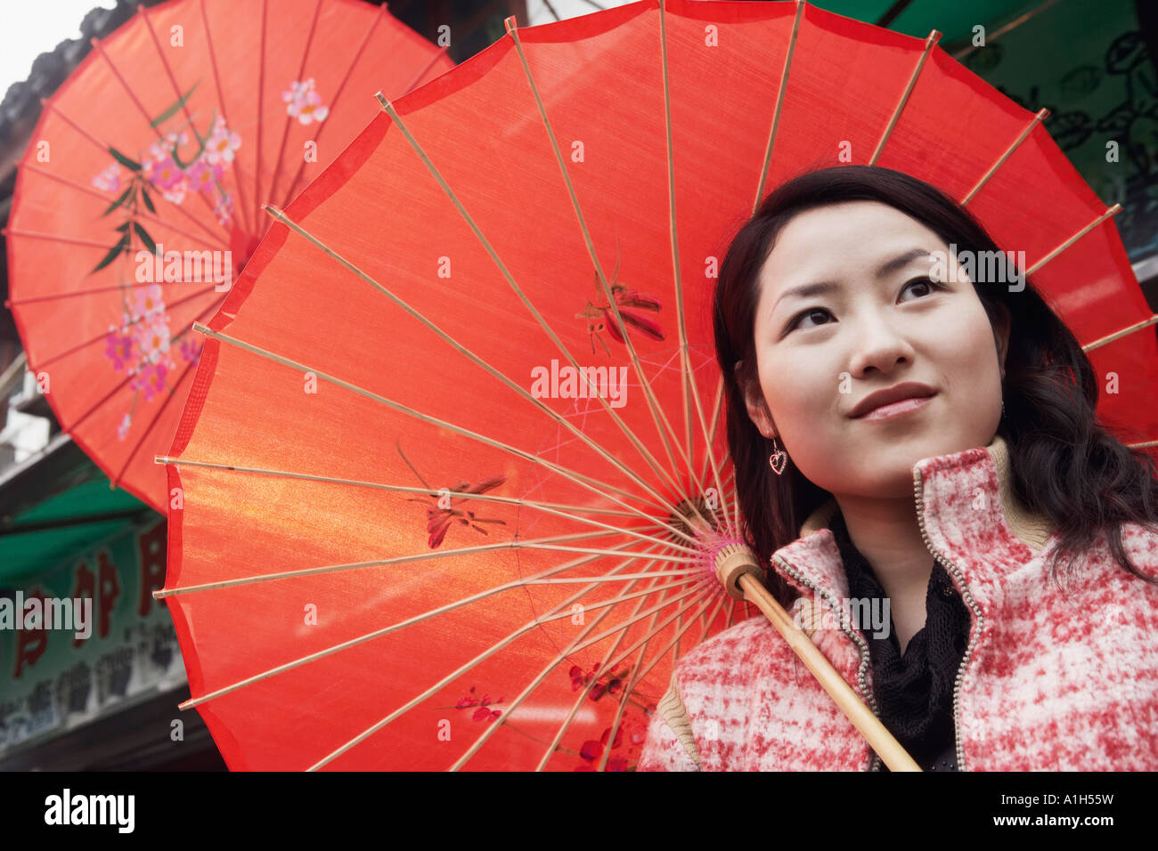 Woman red parasol hi-res stock photography and images - Alamy