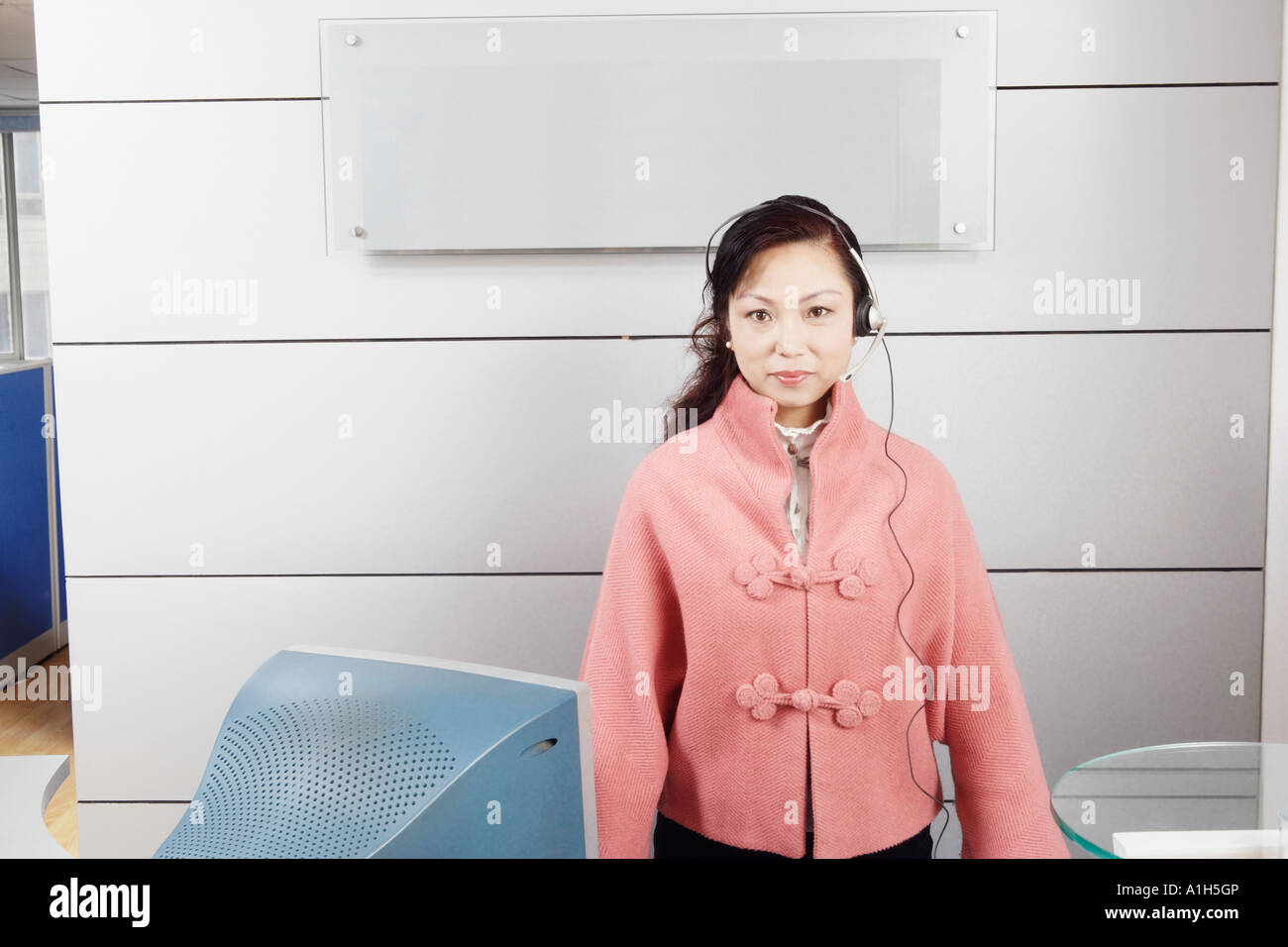 Portrait of a customer service representative standing in an office ...