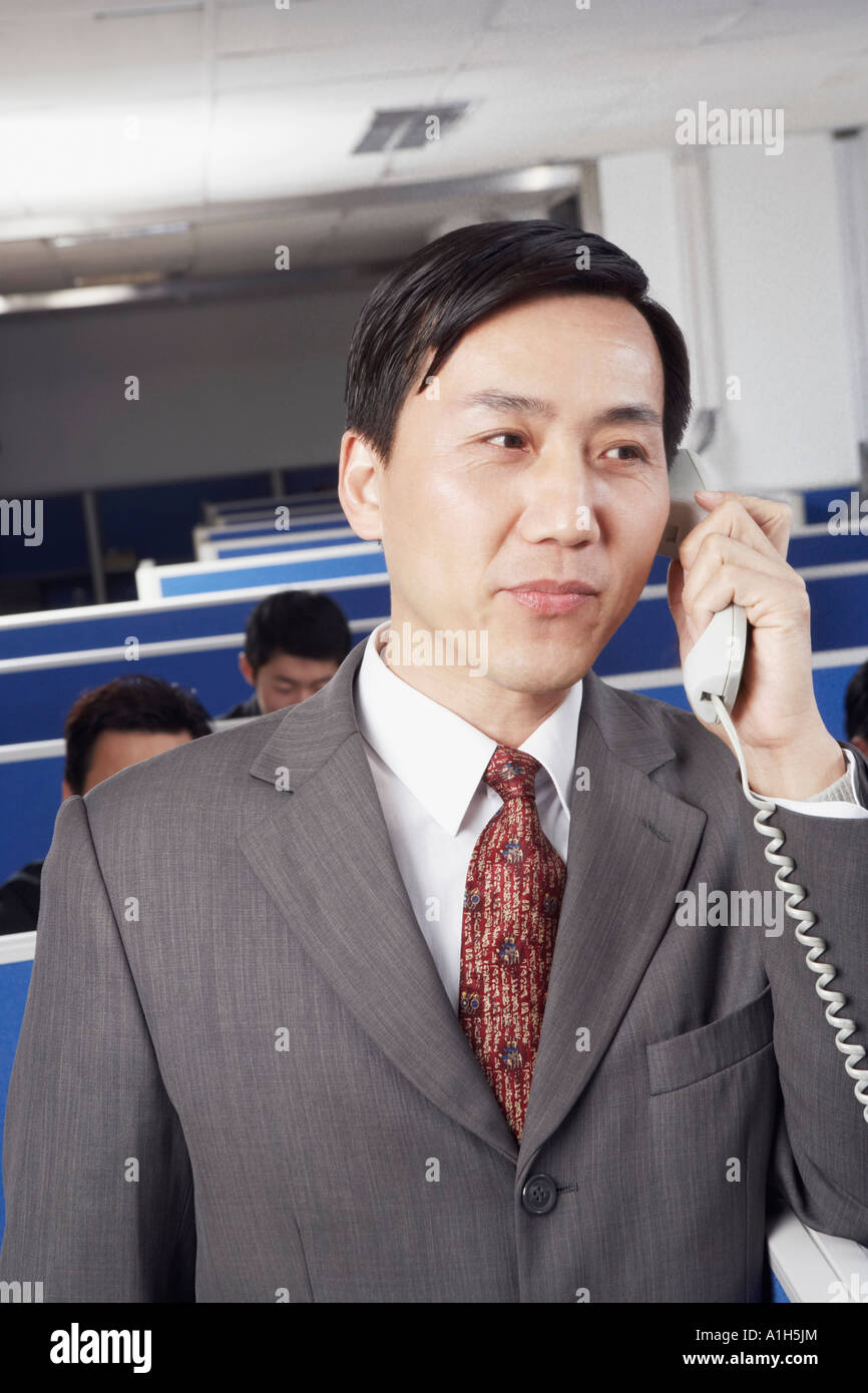 Close-up of a businessman talking on the telephone Stock Photo - Alamy