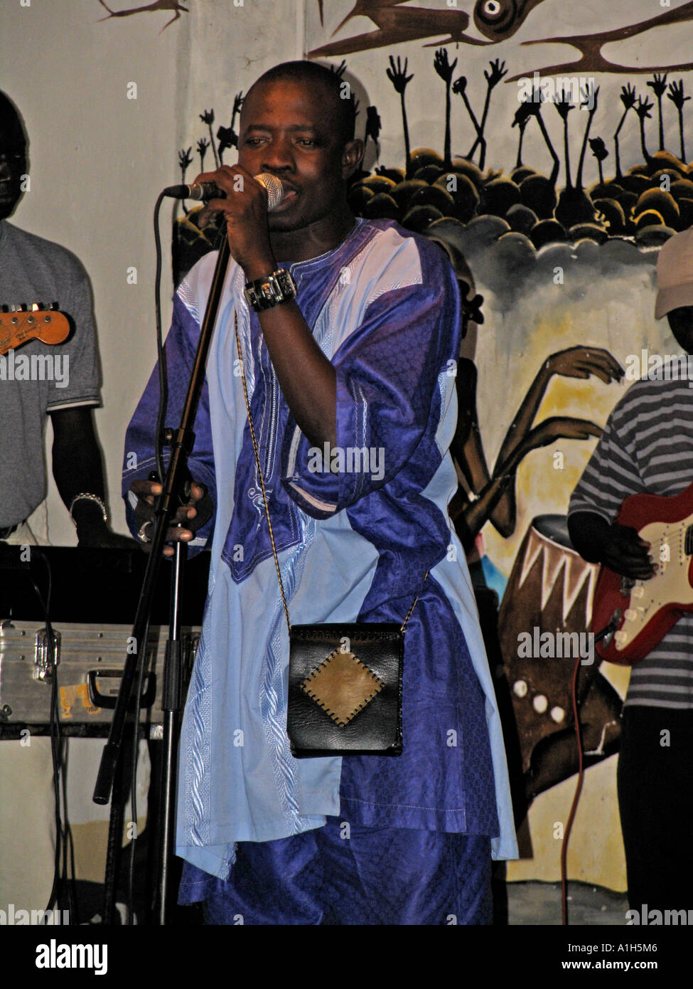 Vocalist in traditional clothes fronts African band nightclub Bakau The ...