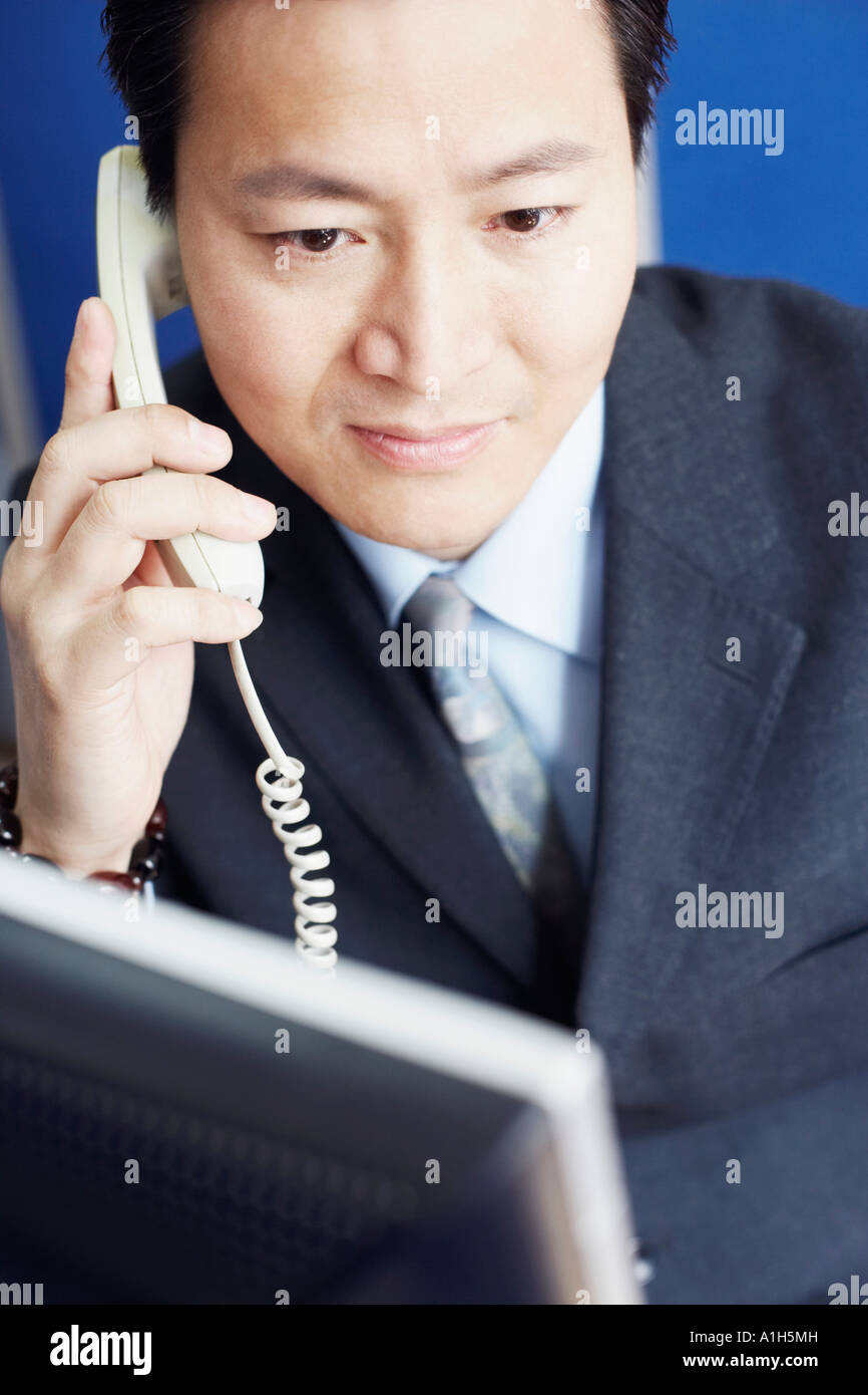 Close-up of a businessman talking on the telephone Stock Photo - Alamy