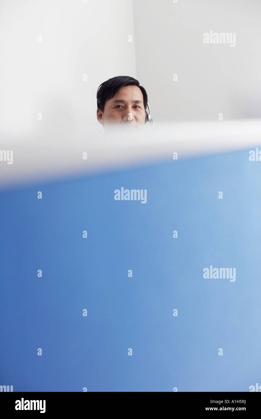 Portrait of a customer service representative behind a cubicle Stock ...