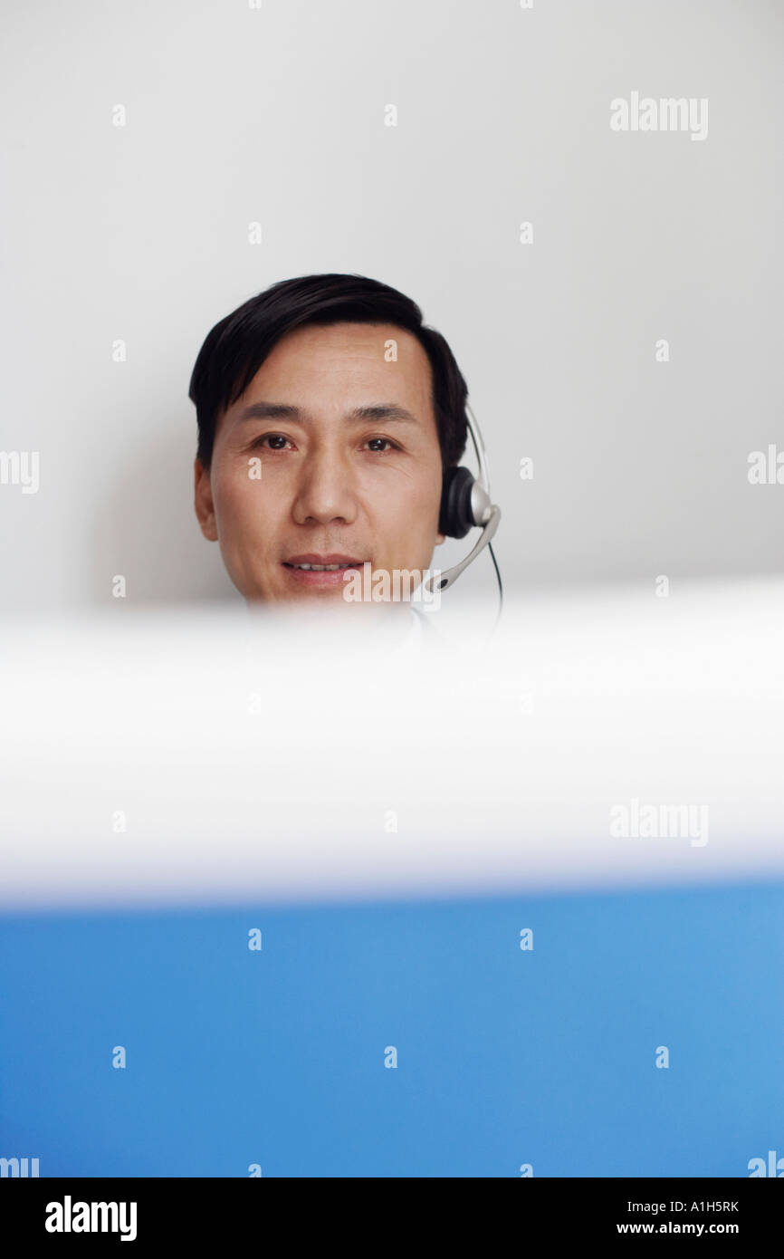 Portrait of a customer service representative behind a cubicle Stock ...